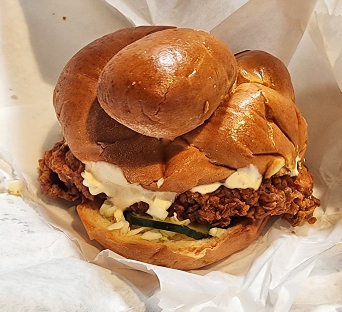 The Lincoln Park chicken schnitzel sandwich – a golden-brown masterpiece on a challah roll. Proof that sometimes the best things in life come between two pieces of bread.