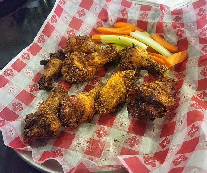 Wings that don't just fly – they soar. Crispy, seasoned perfection served with veggies that pretend you're making healthy choices.
