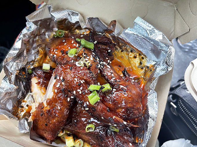 These Korean wings aren't just glazed, they're having their moment in the spotlight—glistening with sweet-spicy sauce and topped with scallions like they're dressed for the BBQ prom.