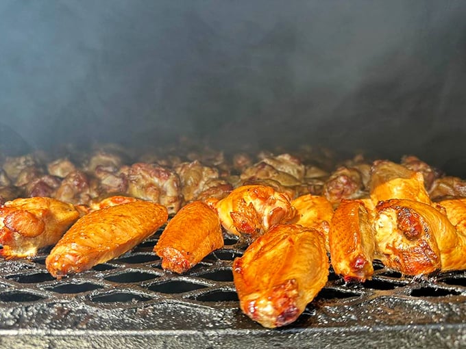 Chicken wings basking in smoky glory. These aren't your average sports bar appetizers—they're the main event.