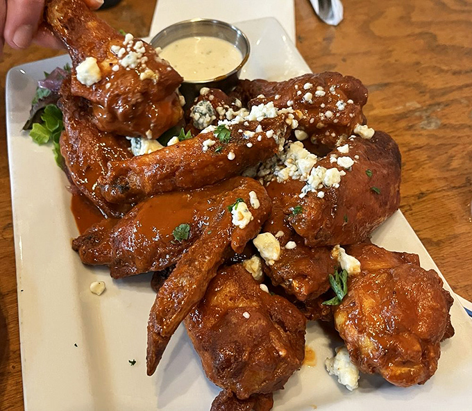 Blue cheese crumbles add a tangy punch to these wings, which aren't just finger-licking good—they're worth-licking-your-neighbor's-fingers good. (Don't actually do that.)
