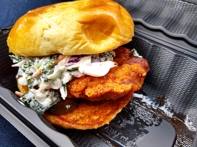 This isn't just a sandwich; it's architecture. The crispy chicken, creamy slaw, and pillowy bun create the Frank Lloyd Wright of handheld comfort food.