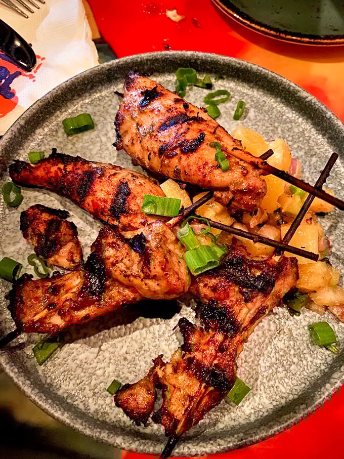 Grilled chicken skewers with a perfect char mark – proof that simple food done right can be the most satisfying art form of all.