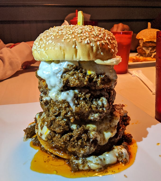 The Tower of Power burger isn't just a meal—it's an engineering marvel that requires both a fork and a signed waiver.