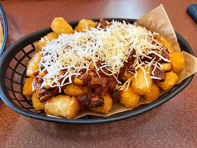 Tater tots get the royal treatment with chili and cheese – comfort food royalty in basket form.