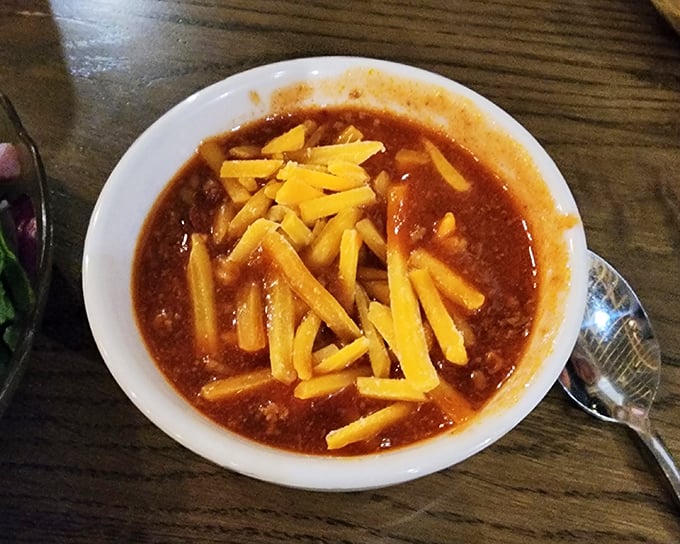 Chili this hearty could make a vegetarian reconsider – topped with enough cheese to build a small fort.