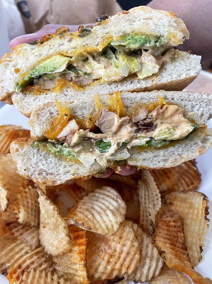 Layer upon layer of chicken, cheese, and veggies—architectural integrity that would make Frank Lloyd Wright proud.