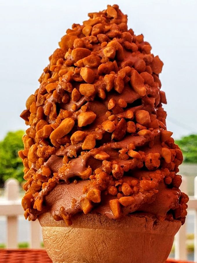 This mountain of chocolate-covered crunch isn't just dessert—it's an engineering marvel that dares you to eat it before gravity wins.