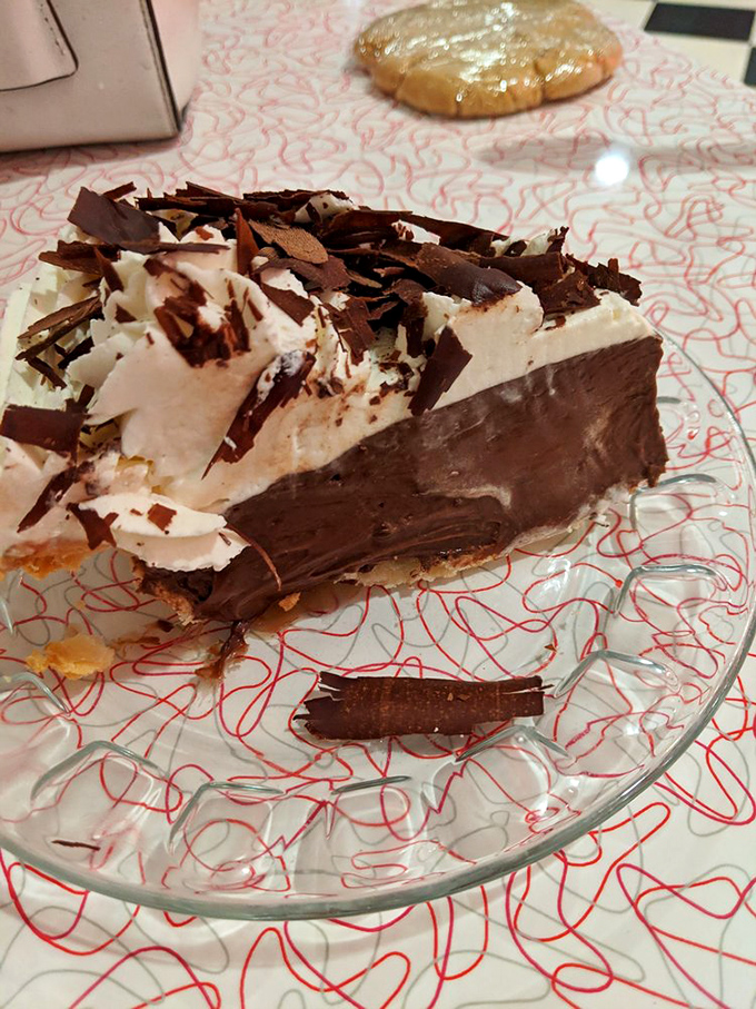 This chocolate cream pie doesn't just satisfy cravings—it creates new ones with its architectural marvel of chocolate shavings.