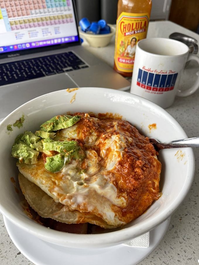 When breakfast gets saucy! Melted cheese blankets this hearty bowl topped with fresh avocado—proof that sometimes messy equals magnificent.