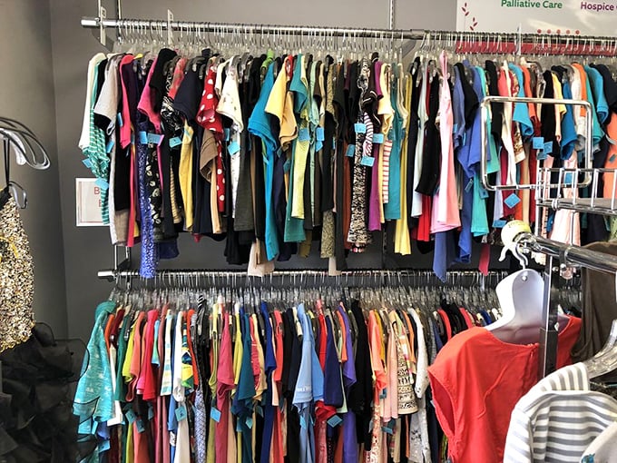 A rainbow of possibilities hanging neatly in a row—each garment with its own story, waiting for you to write the next chapter.