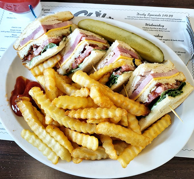 Club sandwiches are the unsung heroes of American cuisine, and Clyde's version—stacked high with layers of goodness—deserves its own theme song.