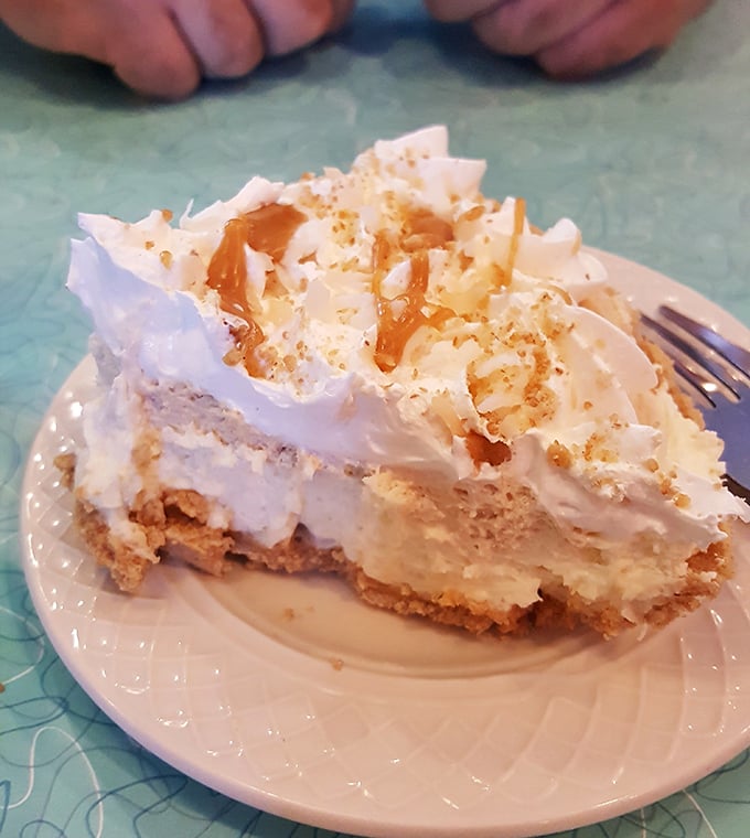 This coconut cream pie doesn't just end a meal – it's the reason you saved room when your brain was saying "I'm full" but your heart knew better.