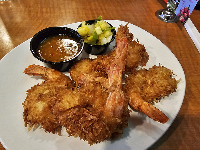 Coconut shrimp that look like they vacationed in the Caribbean and came back with stories to tell. That dipping sauce is their trusty sidekick.