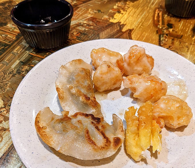 These golden-fried dumplings and tempura shrimp aren't just appetizers – they're the opening act to a magnificent culinary concert.
