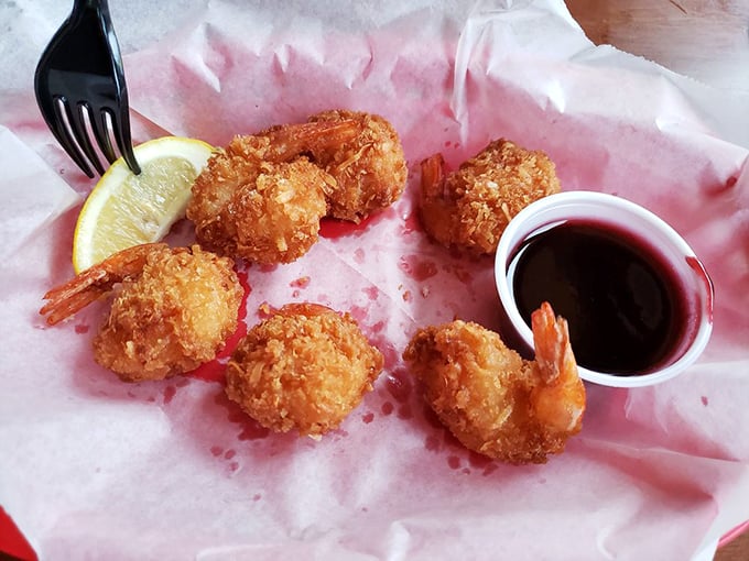 Coconut shrimp that crunch like your footsteps on perfect beach sand, with a raspberry sauce that hits the sweet-tart bullseye every time.