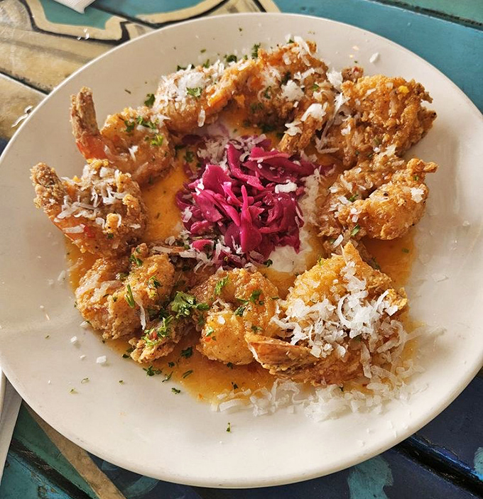 Coconut shrimp arranged like a sunburst, with that vibrant slaw center stage. The kind of dish that makes everyone at nearby tables ask, "What's that?"