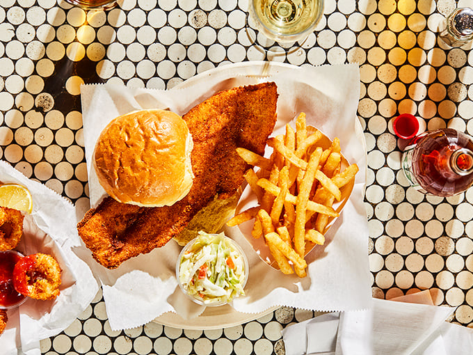 The fish sandwich that launched a thousand Pittsburgh memories—crispy, golden cod spilling gloriously beyond its bun like it's making a break for freedom.