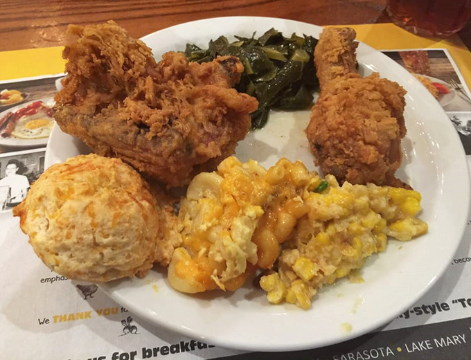 Golden fried chicken with collard greens, mac and cheese, and creamy corn casserole—a Southern comfort feast that makes Monday feel like Sunday dinner.