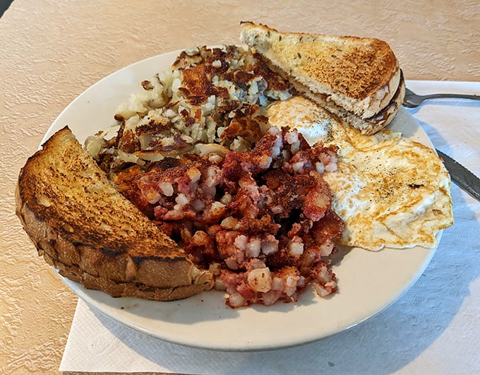 Corned beef hash with that perfect crispy-to-tender ratio – the breakfast of champions and late-night philosophers alike.