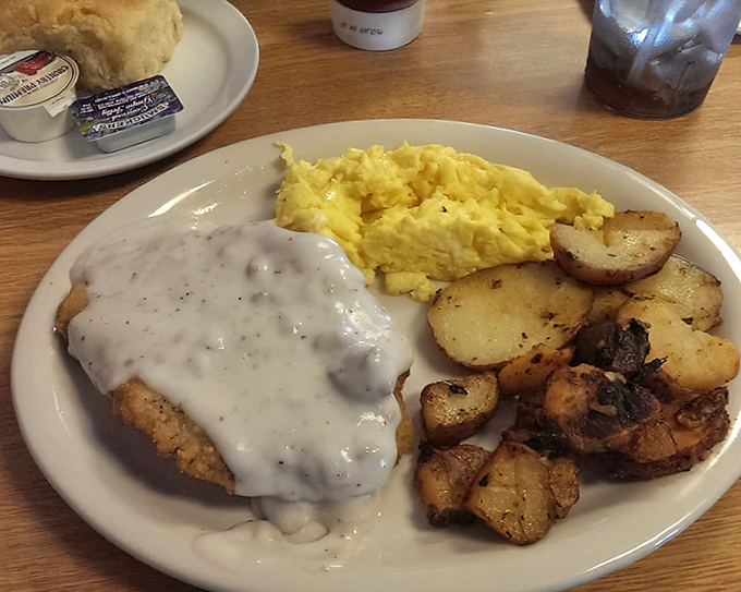 Country fried steak that deserves its own zip code. The perfect trifecta of crispy meat, creamy gravy, and golden potatoes.