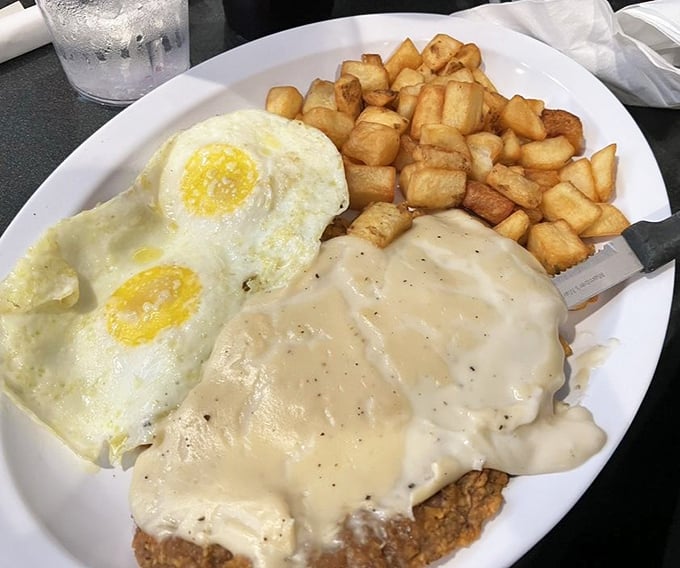 Country fried steak that could make a vegetarian reconsider life choices. Those golden potatoes and creamy gravy are the supporting actors in this breakfast drama.