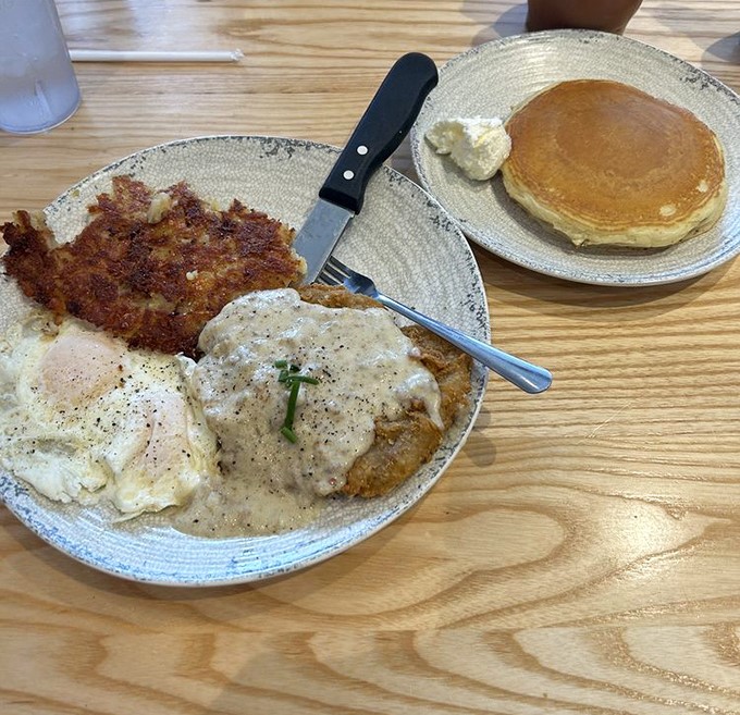 Country fried steak with eggs and gravy—the breakfast equivalent of a warm Southern hug that says, "Bless your heart, you needed this."