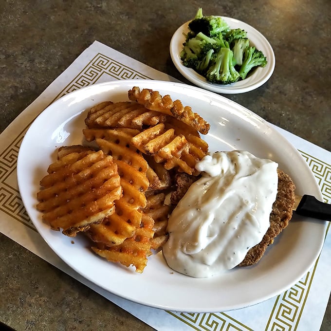 Country fried steak with gravy so good you'll want to write it a thank-you note. Those waffle fries aren't just sides—they're supporting actors deserving their own award.