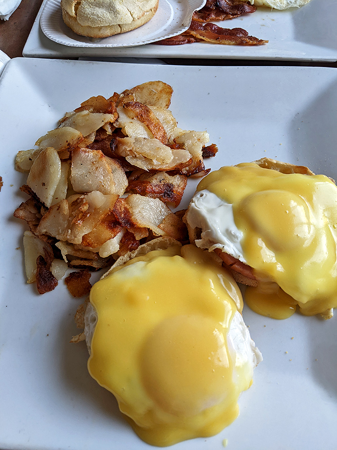 Hollandaise sauce cascading over poached eggs like a golden waterfall—Benedict Arnold may have been a traitor, but Eggs Benedict is forever loyal.