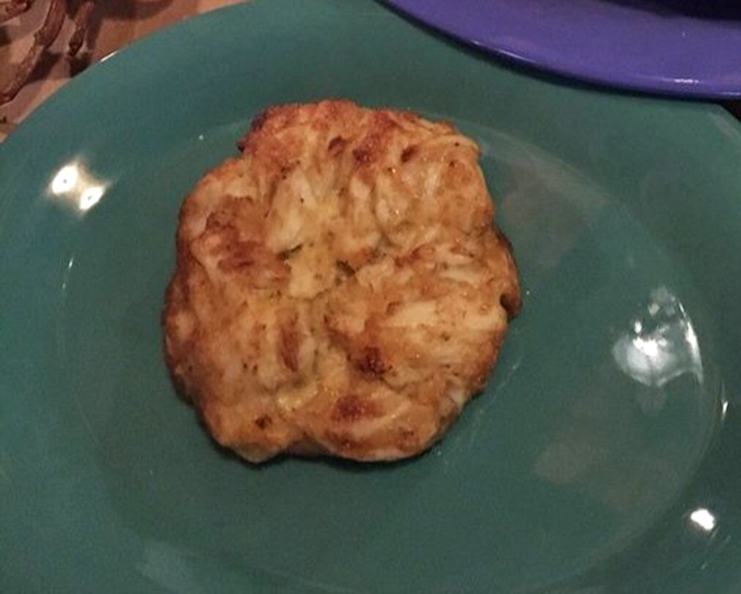 A proper Maryland crab cake doesn't need fancy presentation—just enough binding to keep the sweet crab meat together on its journey from plate to mouth.