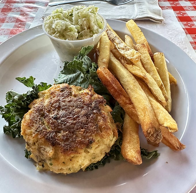 This crab cake doesn't hide behind fillers—it's the Meryl Streep of seafood, delivering a star performance with just enough supporting ingredients.