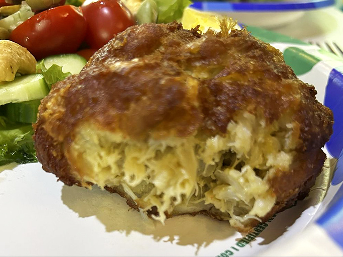 This crab cake isn't just food—it's edible Maryland heritage. Look at that lump meat ratio! Practically all crab with just enough binding to keep it together.