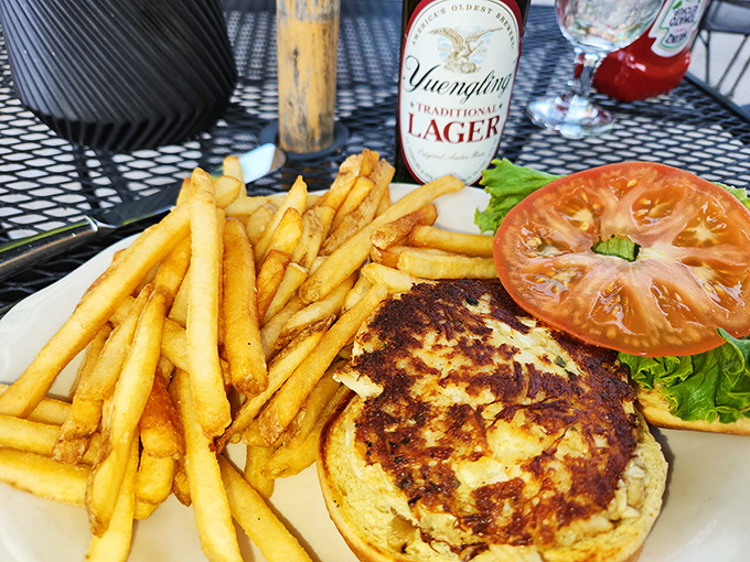 The perfect marriage of crispy and tender—this crab cake sandwich with golden fries might just be worth crossing state lines for.