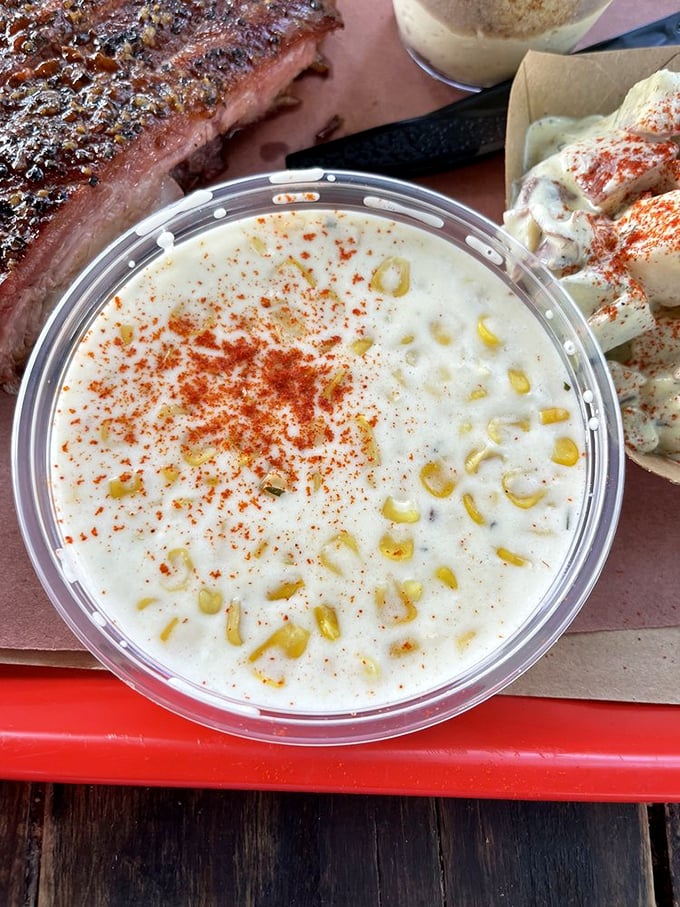 Creamed corn that would make your grandmother suspicious of her own recipe—sweet, savory perfection in a cup.