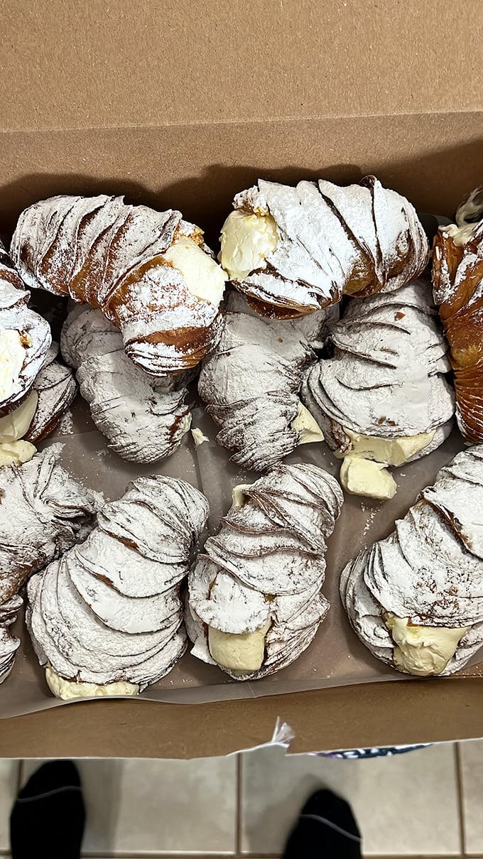 Sfogliatelle so flaky they create their own weather system. These cream-filled Italian pastries are worth every buttery, powdered-sugar-dusted calorie.