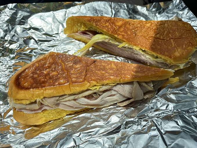 Behold the architectural marvel that is a proper Cuban sandwich—crisp exterior, melty interior, and that perfect ratio of meat to cheese to pickle.