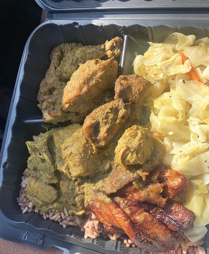 Curry chicken that doesn't just sit on the plate—it performs a full flavor concert with rice and cabbage as backup singers.