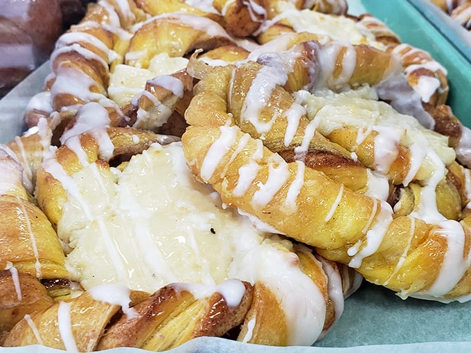 These Danish pastries aren't just breakfast – they're edible art with ribbons of icing that would make Jackson Pollock jealous.