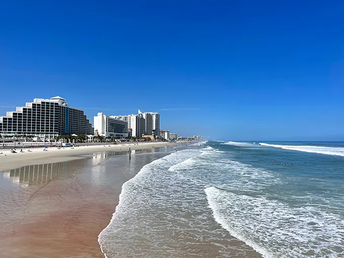 The hard-packed sand meets gentle waves in nature's perfect compromise. Here's where your morning walks come with complimentary dolphin sightings.