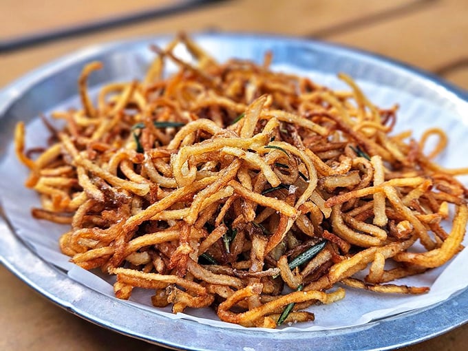 These aren't your average fries—they're a tangle of crispy, golden potato strands that crunch with each bite, making regular fries seem like a distant, inferior memory.