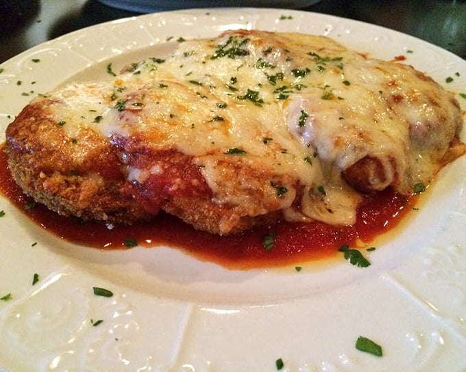 This eggplant parmigiana doesn't just melt in your mouth – it stages a full-scale flavor invasion that'll have you plotting your next visit before the plate's empty. 