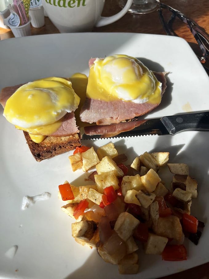 Eggs Benedict done right – that hollandaise cascading like a yellow waterfall over Canadian bacon with potatoes O'Brien standing by for backup.