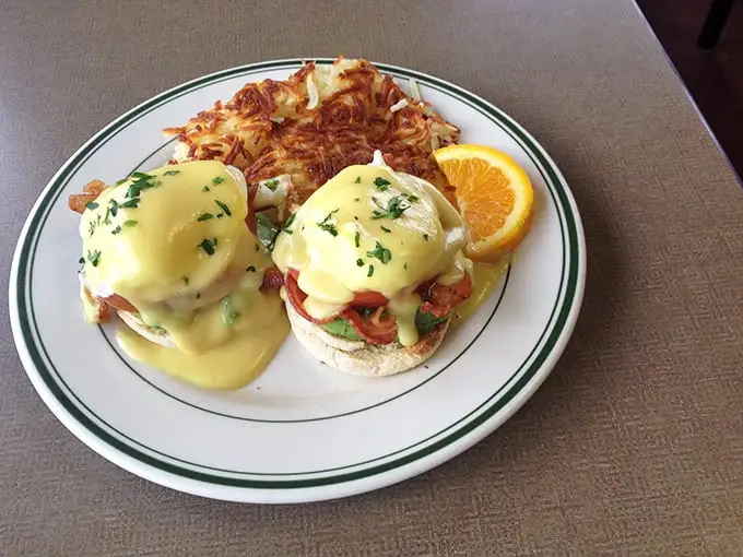These Eggs Benedict aren't trying to reinvent breakfast; they're just executing it flawlessly with golden hollandaise cascading over Canadian bacon like a sunrise worth waking up for.