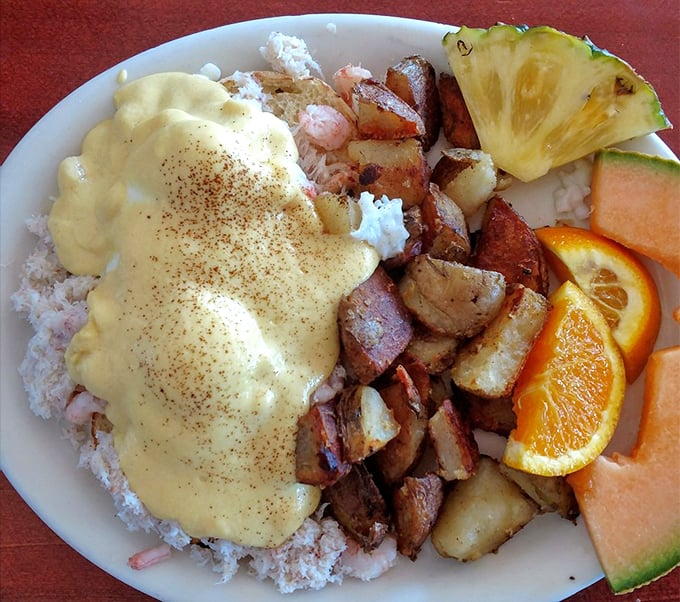 Eggs Benedict crowned with crab and shrimp transforms ordinary mornings into something worth celebrating with champagne.