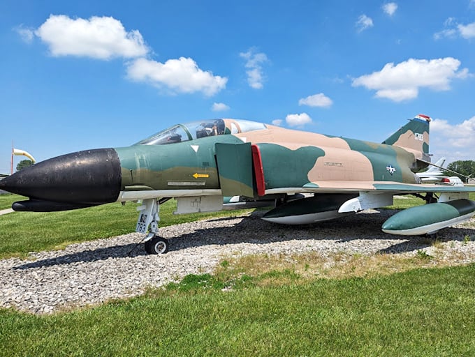 The iconic F-4 Phantom – with its distinctive camouflage pattern telling stories of jungle missions that defined an era of American aviation. 