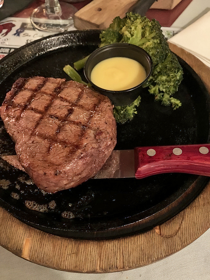 This filet mignon isn't just cooked—it's been treated with the reverence it deserves. Those perfect grill marks are like a carnivore's roadmap to happiness.