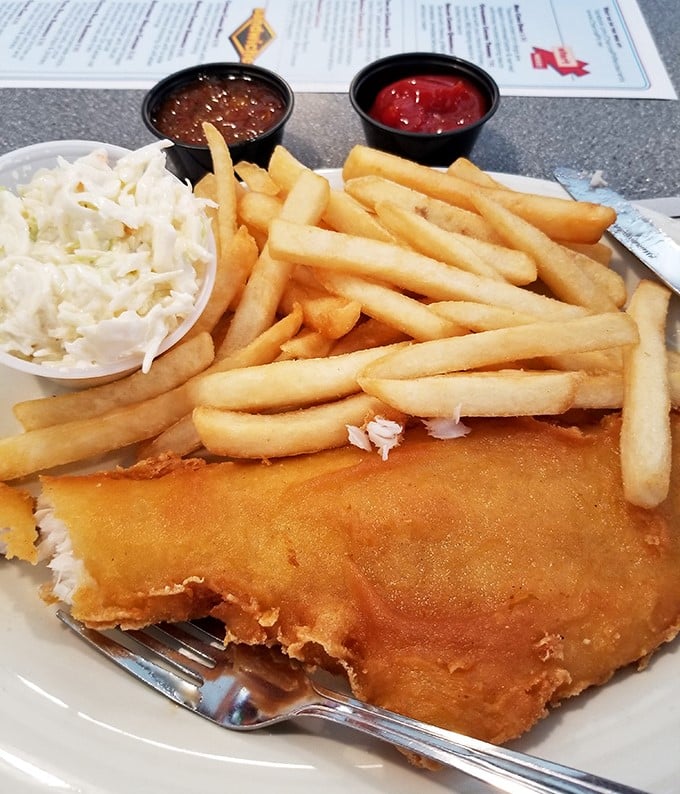 Fish and chips that would make a British pub proud. Golden, crispy batter protecting flaky white fish—a maritime marriage made in heaven.