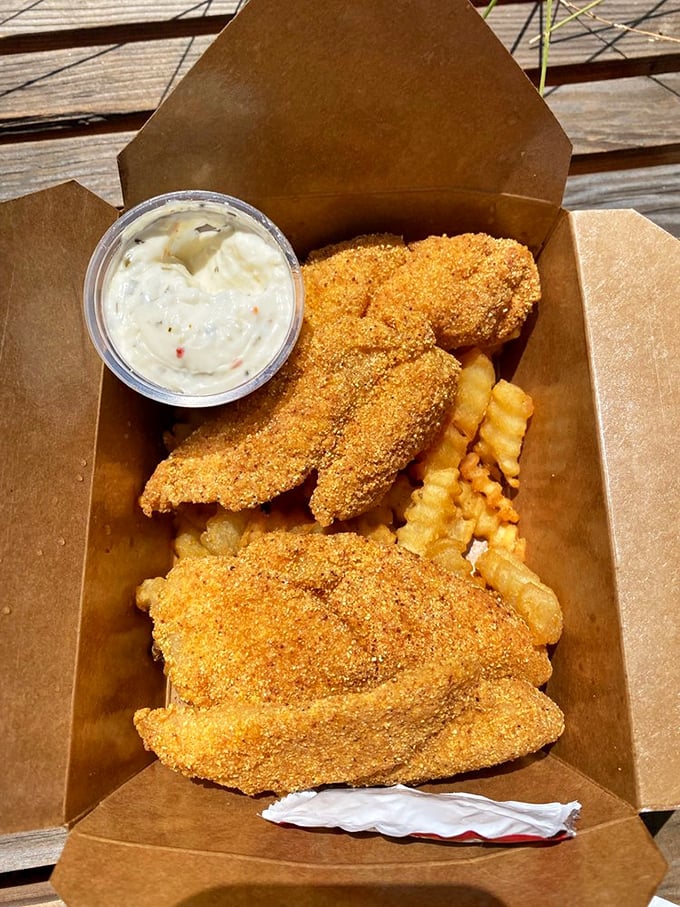 Golden-crusted fish and chips that would make a British pub jealous, served in an unpretentious cardboard container – because fancy plates would just get in the way.