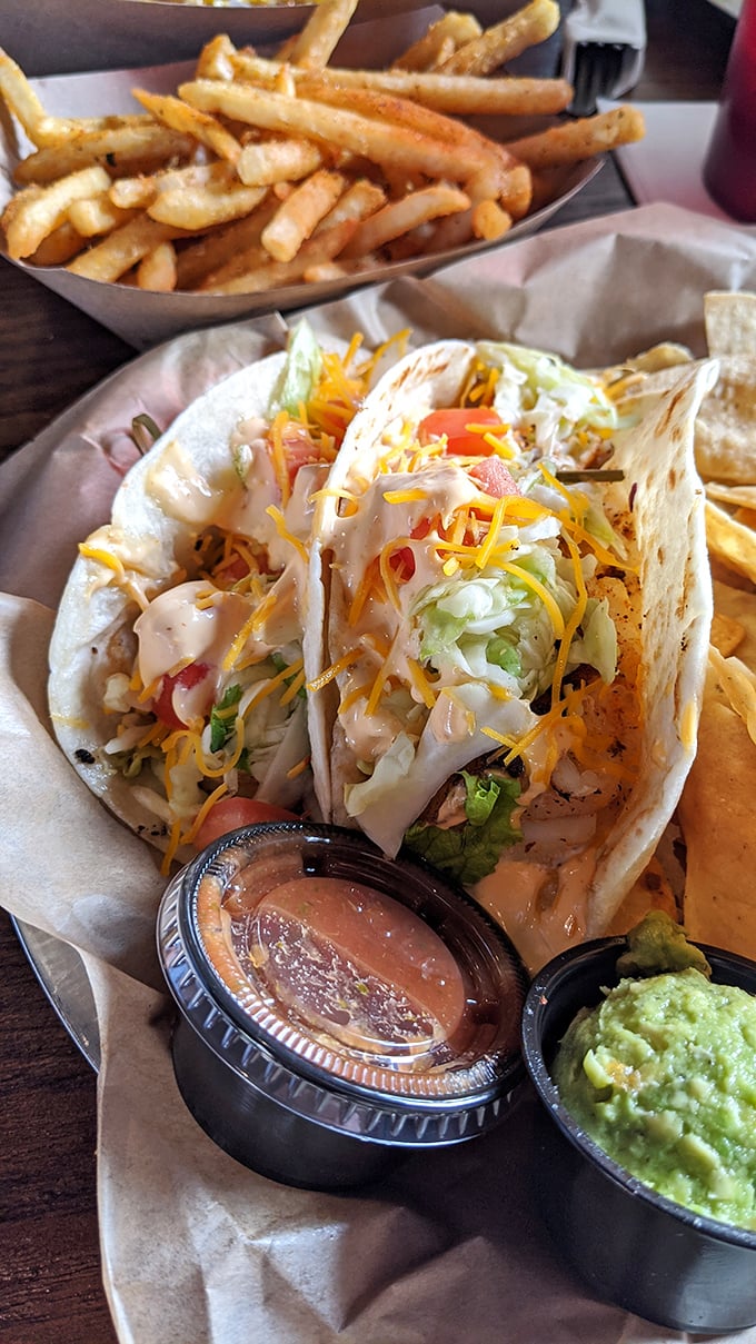 Fish tacos that make you question why you ever eat anything else. The colorful toppings aren't just garnish – they're confetti for your taste buds' celebration.