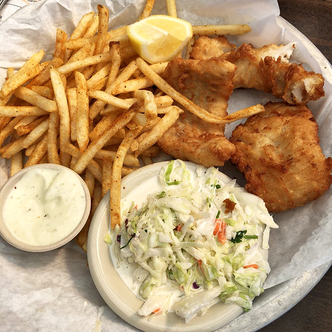 Golden fish and chips with coleslaw – the kind of plate that makes you wonder why you ever eat anything else.